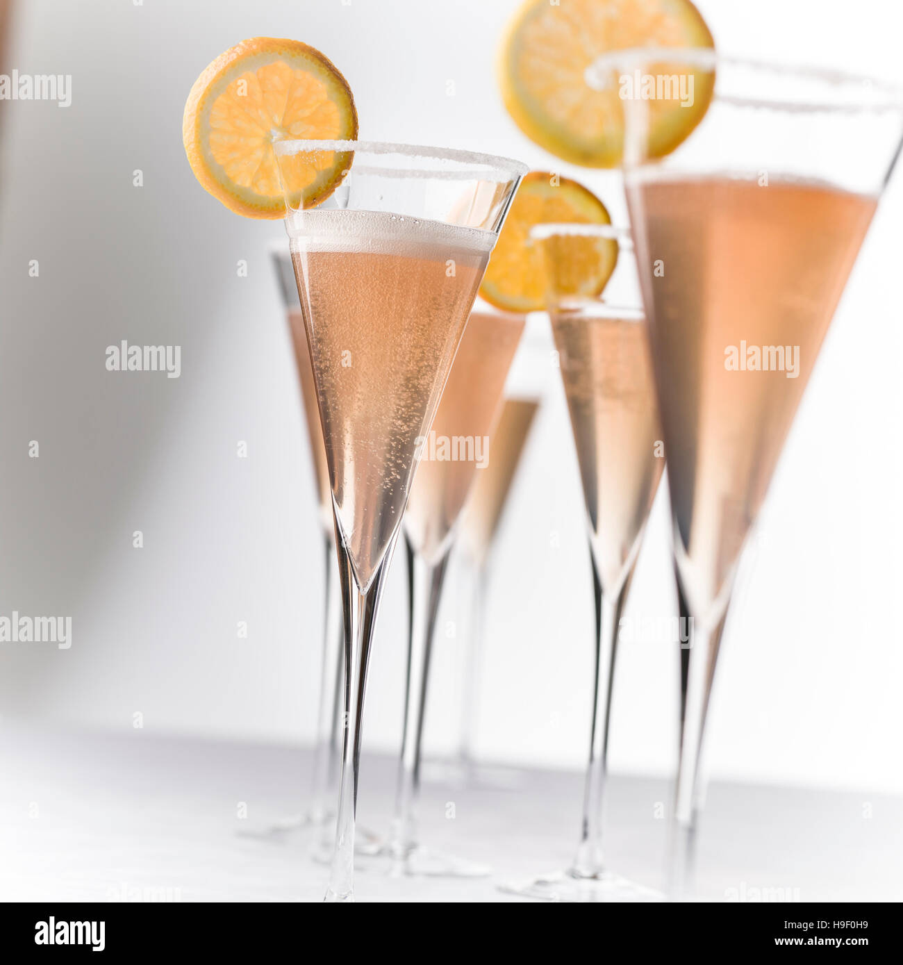 Champagne with lemon slices Stock Photo - Alamy