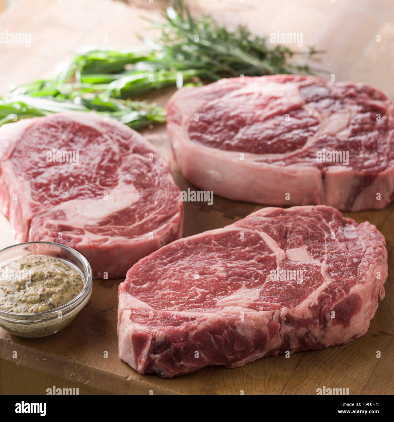 Raw ribeye steaks Stock Photo - Alamy