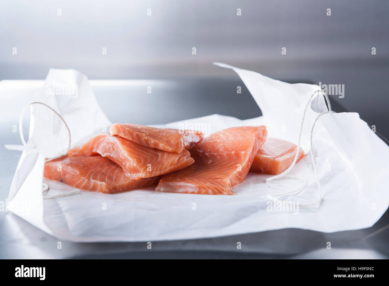 Raw salmon fillets on butcher paper Stock Photo - Alamy