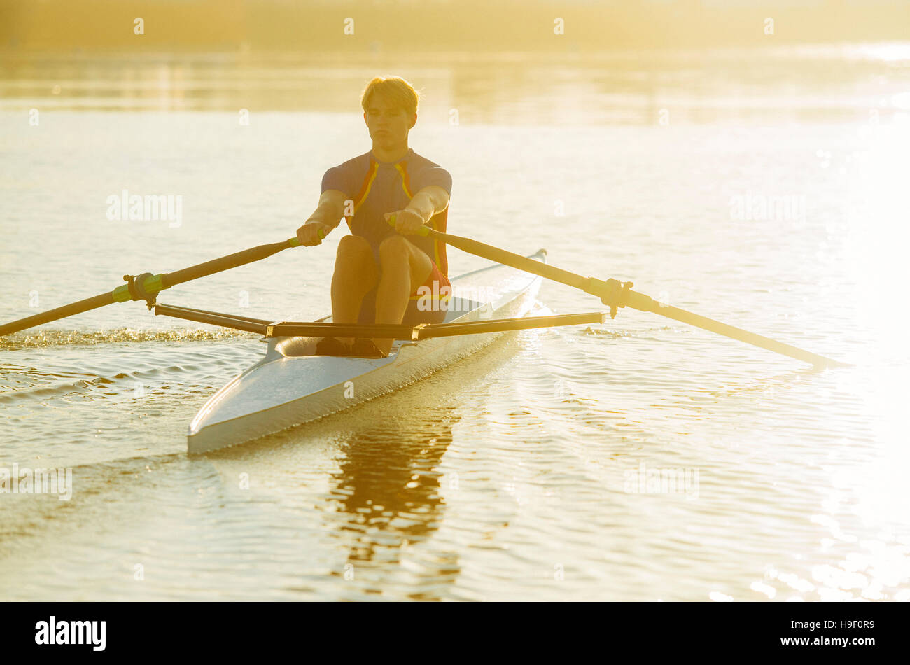 Sunset group rowing hi-res stock photography and images - Alamy