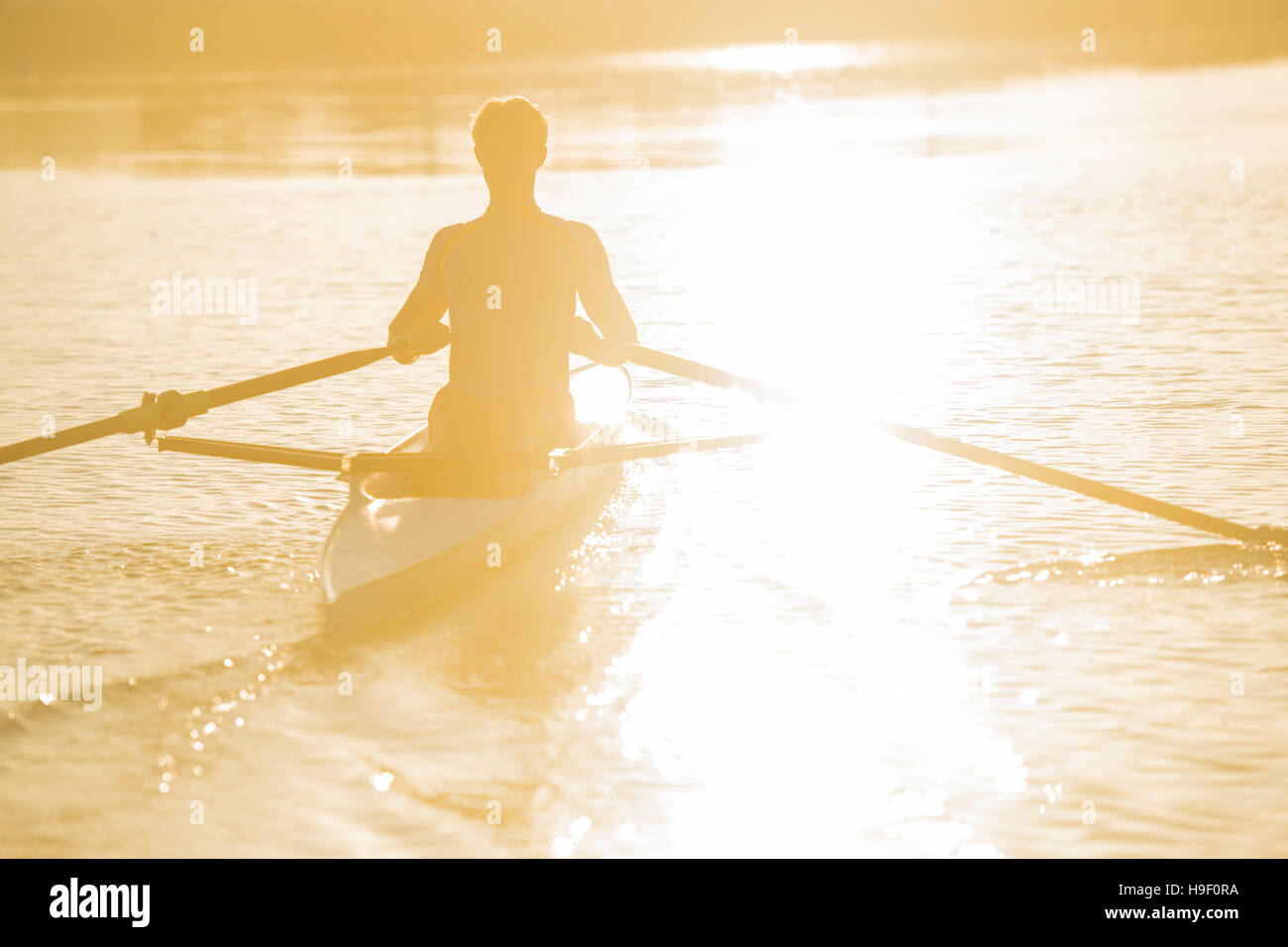 Sunset group rowing hi-res stock photography and images - Alamy
