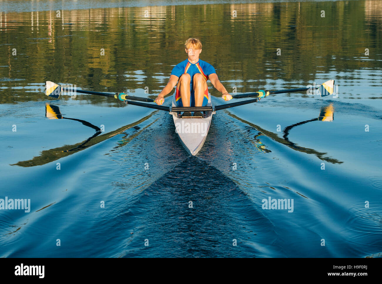 Caucasian man rowing on river Stock Photo - Alamy