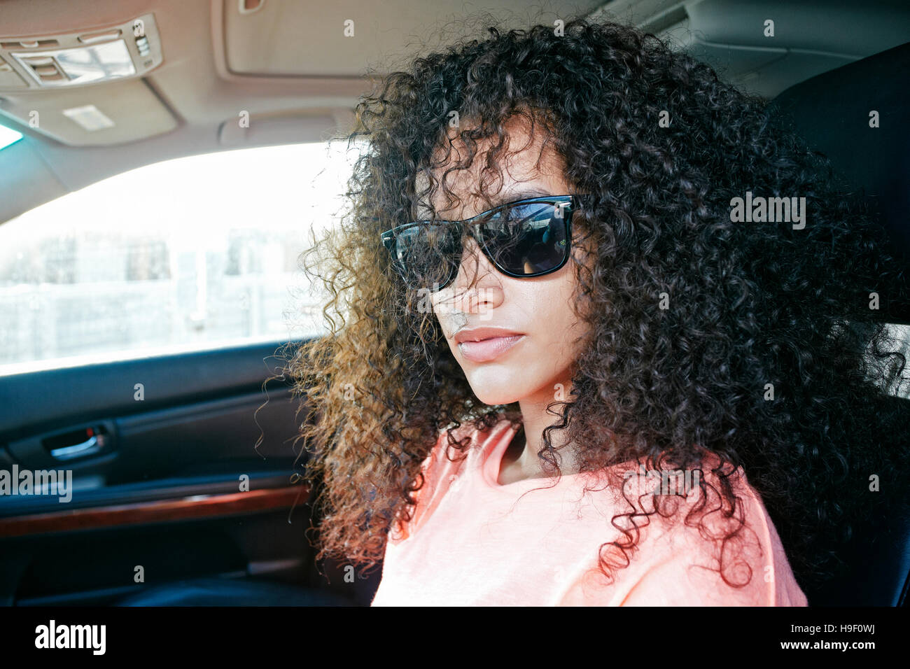 Portrait of Hispanic woman driving car Stock Photo - Alamy