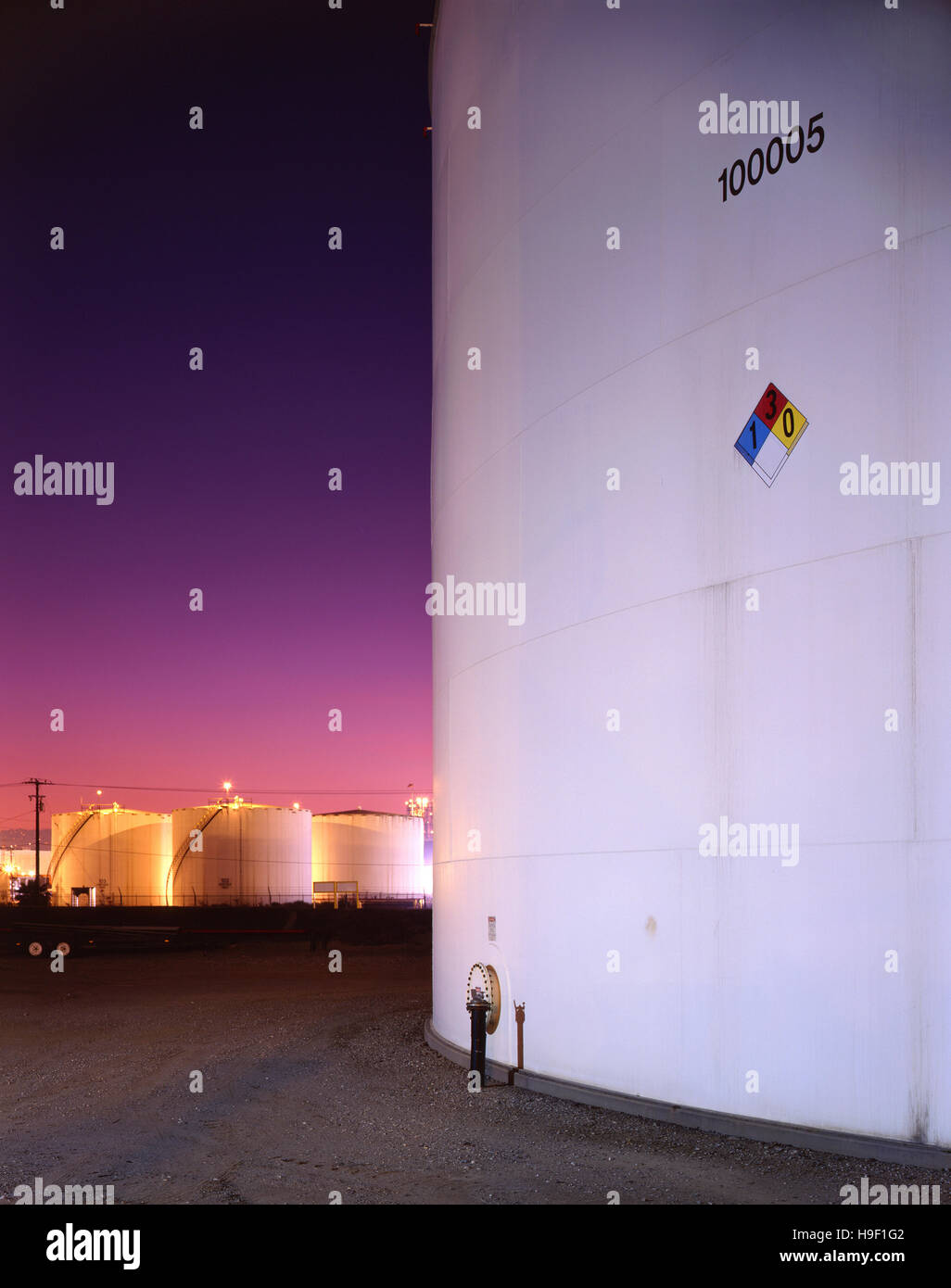 Storage tanks at night Stock Photo - Alamy
