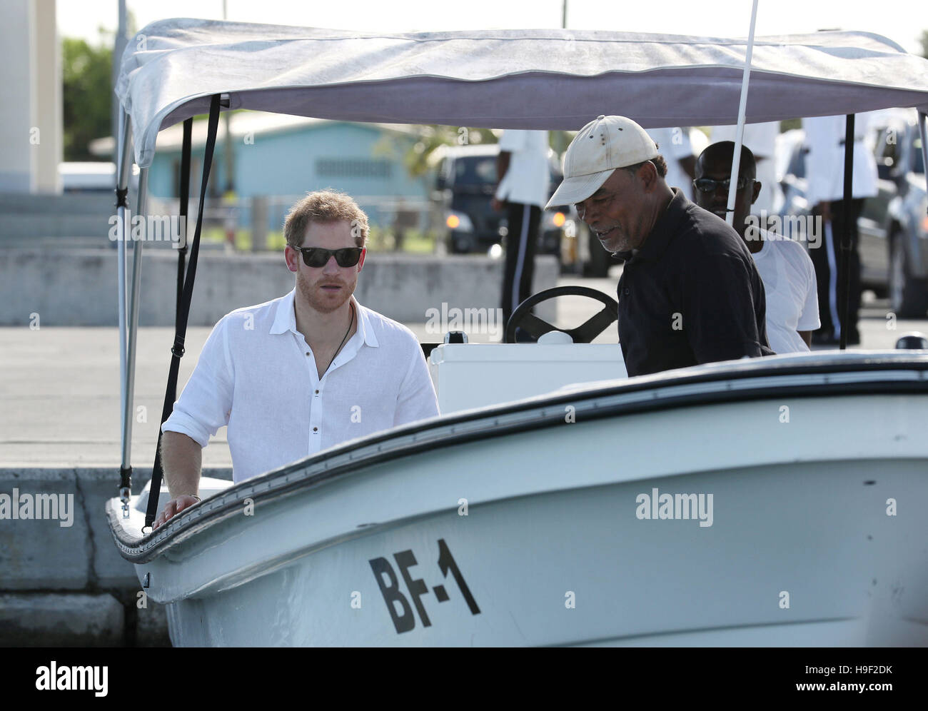 Prince Harry takes a boat tour through mangroves on the island of ...