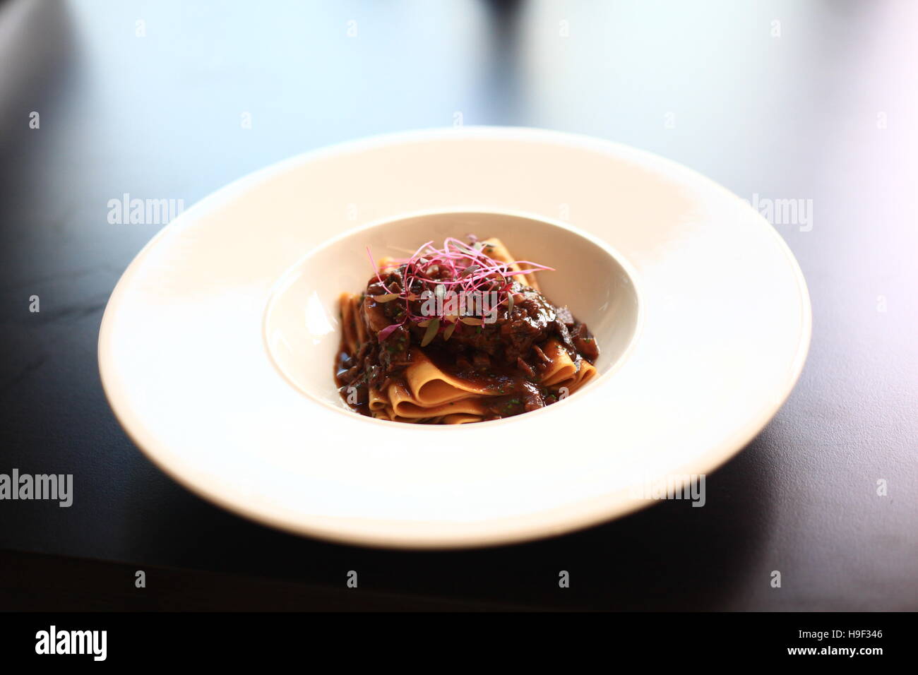 Pappardelle pasta with beef cheeks Stock Photo - Alamy