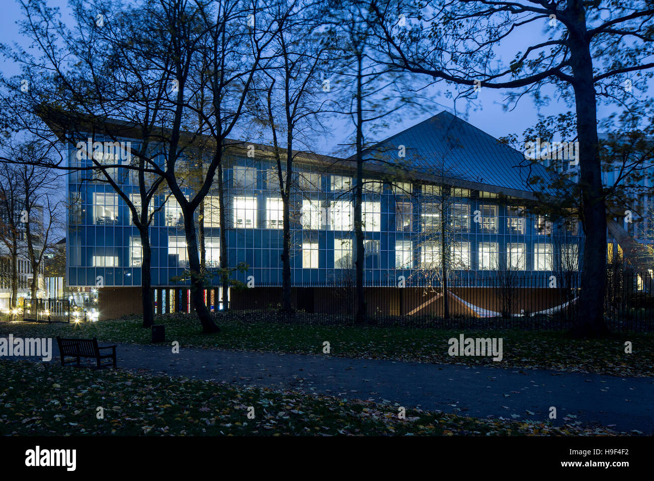 Exterior view at dusk through park. Design Museum, London, United ...