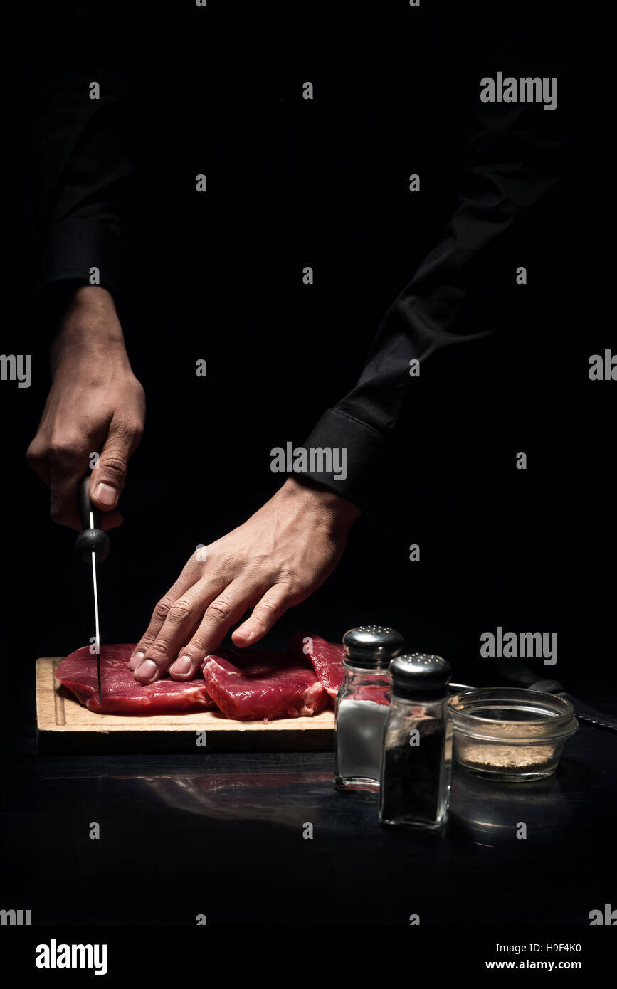 Male chef chopping meat knife hi-res stock photography and images - Alamy