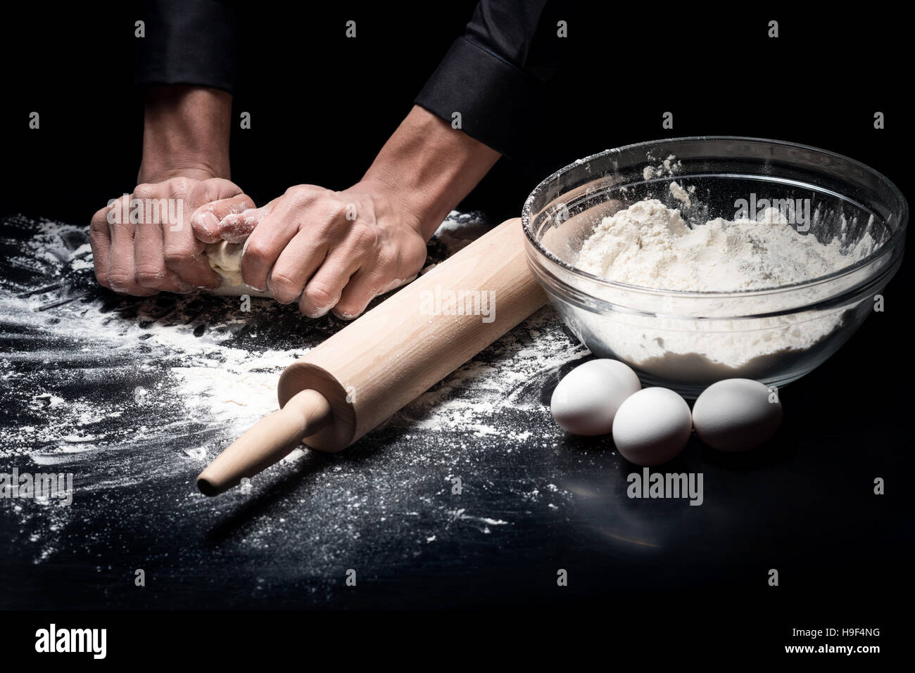 Hands flour dough black hi-res stock photography and images - Alamy