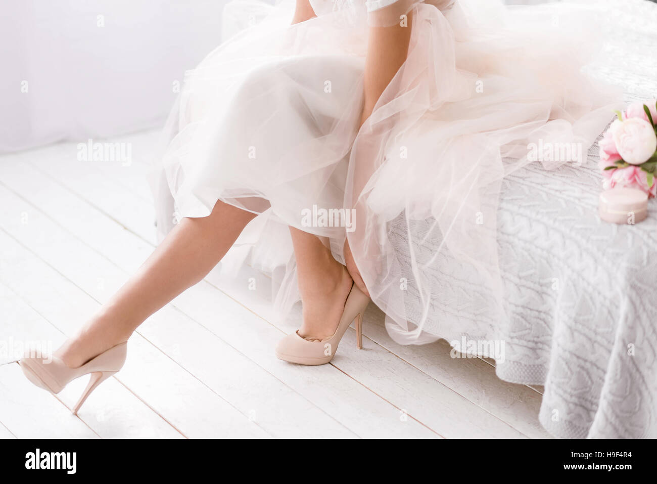 Bride sitting on bed hi-res stock photography and images - Alamy