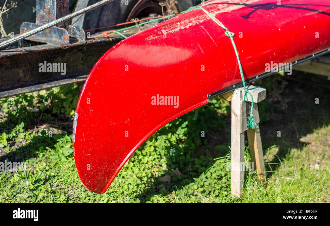 Close up of an old red canoe stored upside down Stock Photo - Alamy