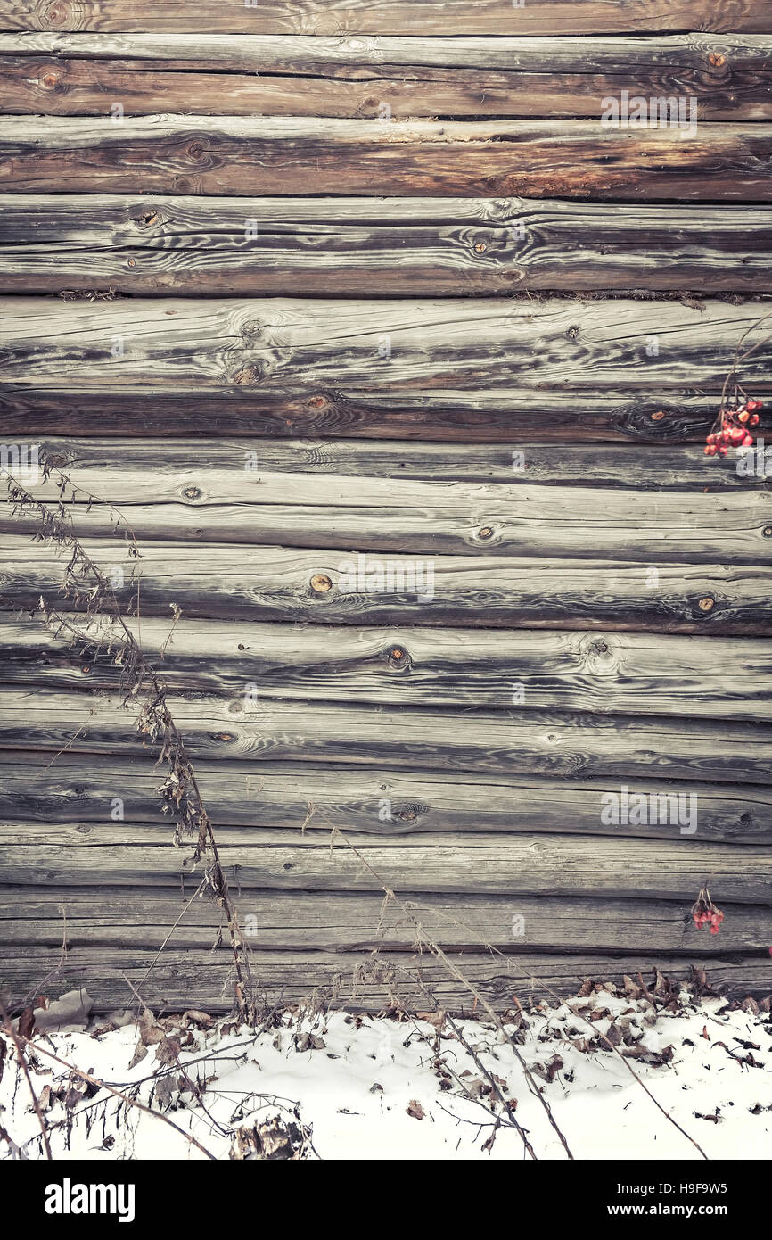 Rustic wooden wall of cabin with snow as winter background with copy ...