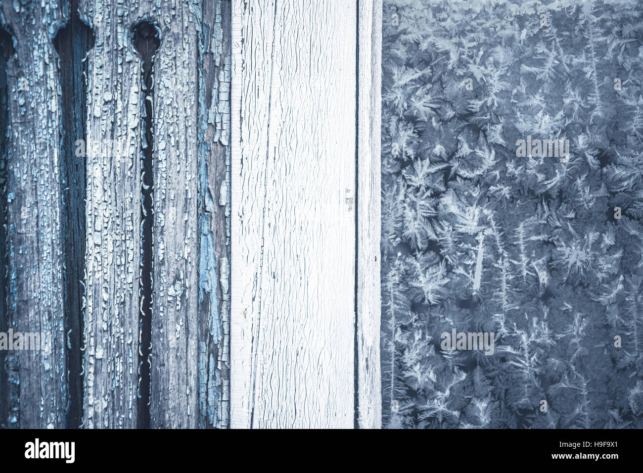 Winter background with frost pattern on rustic window with copy space ...