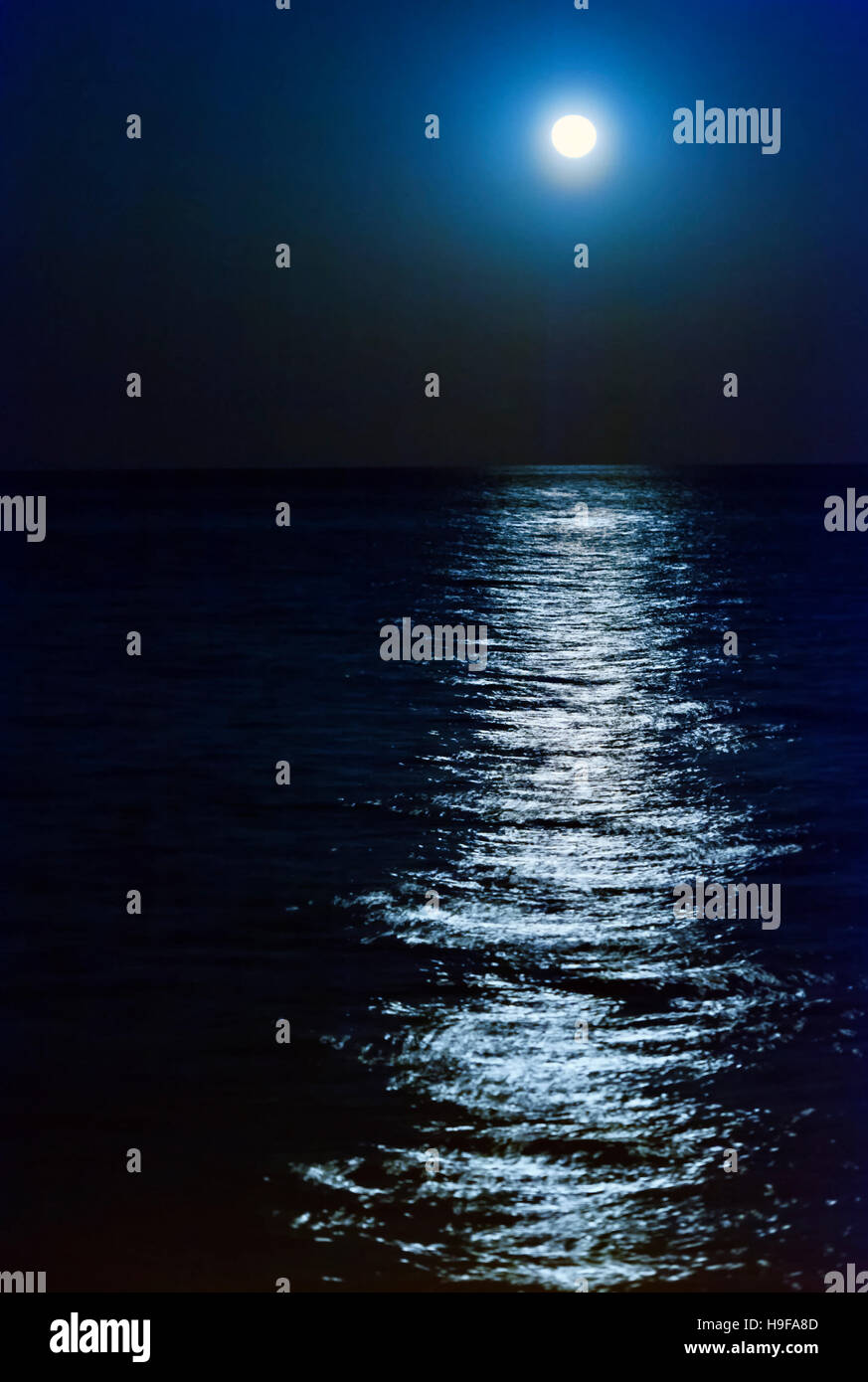 Moonlit Ocean Scene at night Stock Photo - Alamy