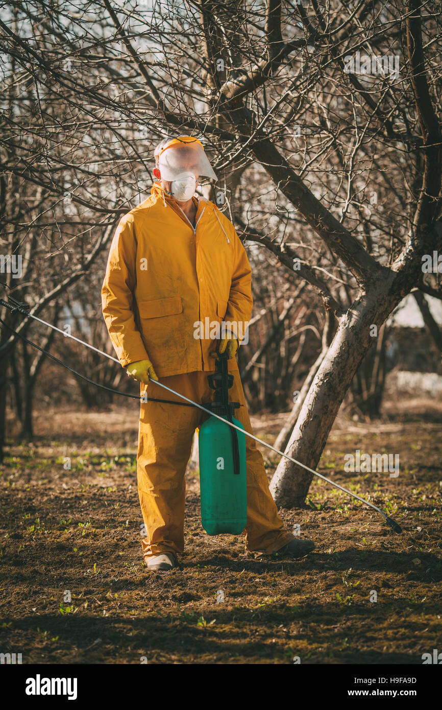 Man spraying plant in orchard hi-res stock photography and images - Alamy