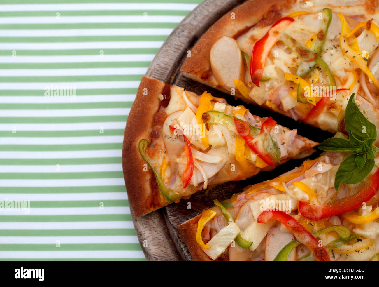 Delicious homemade pizza with ham and vegetables Stock Photo - Alamy