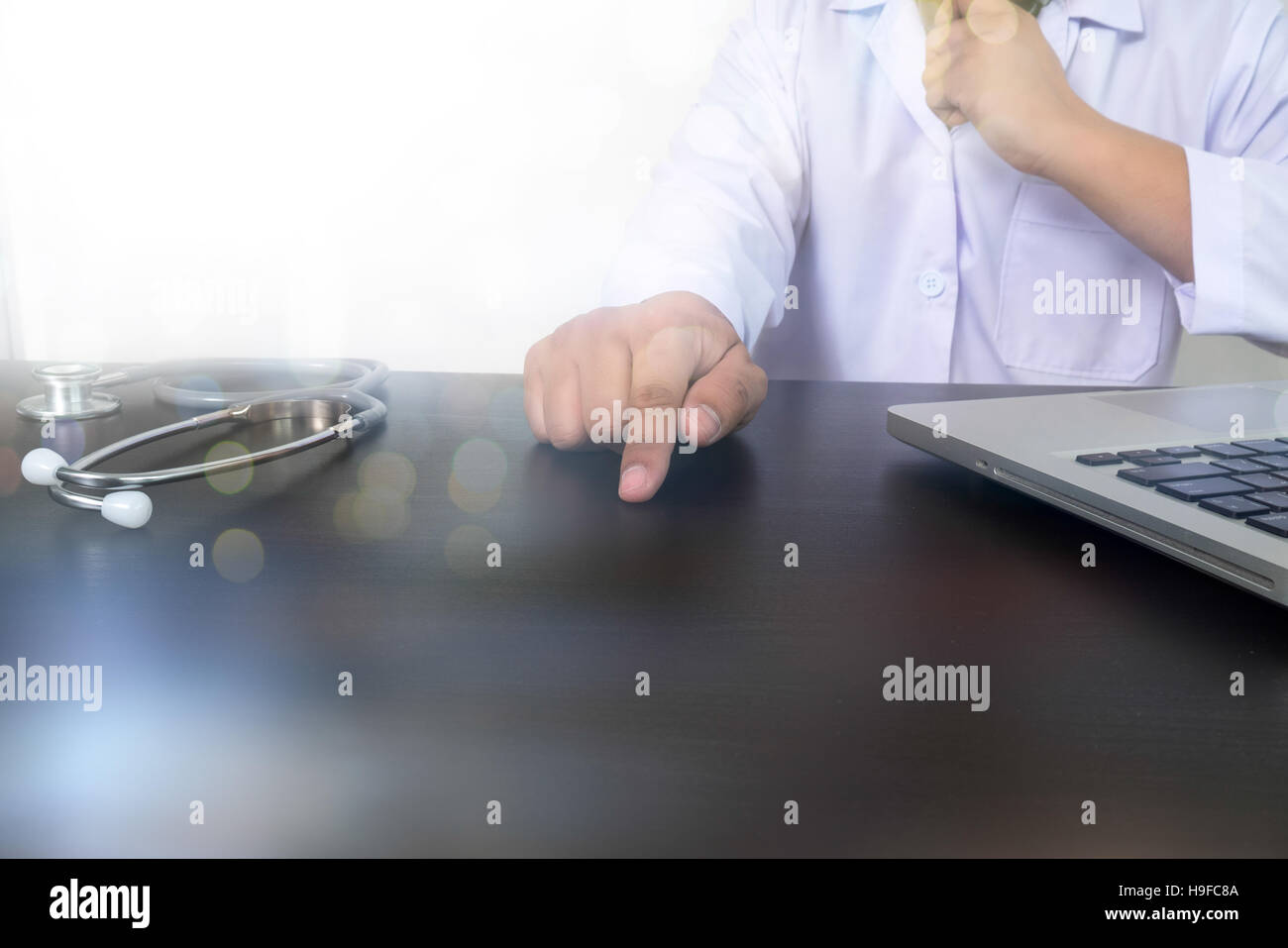 doctor working with laptop computer in medical workspace office Stock ...
