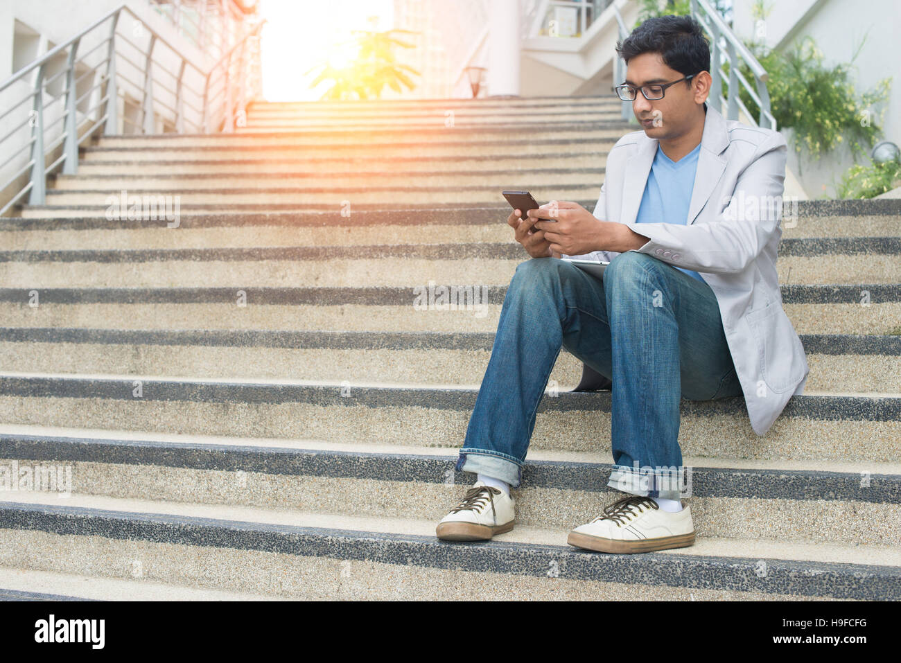 indian male using phone Stock Photo - Alamy