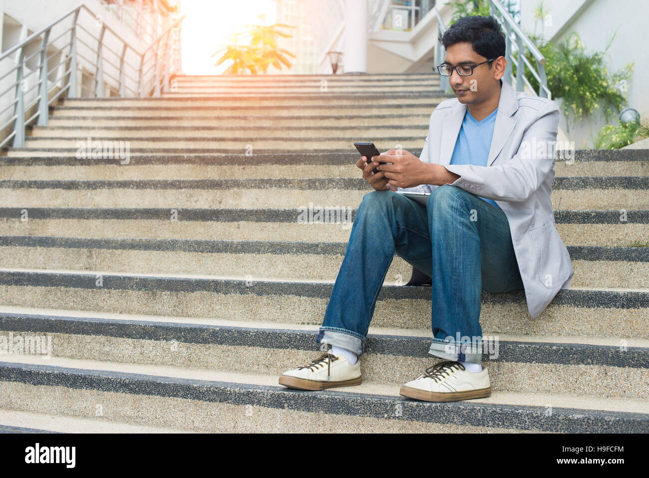 indian male using phone Stock Photo - Alamy