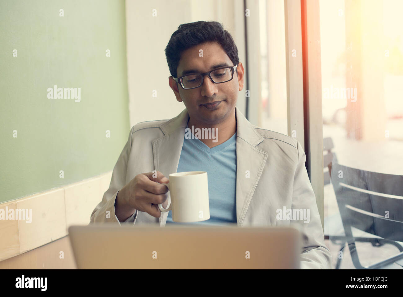 indian male drinking coffee Stock Photo - Alamy
