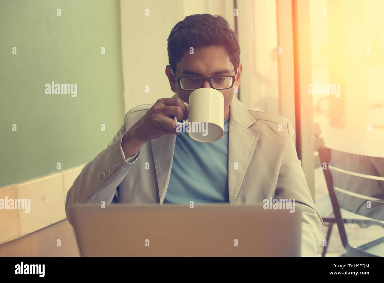 indian male drinking coffee Stock Photo - Alamy