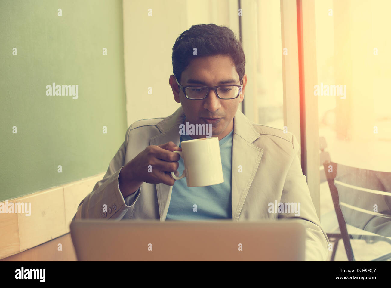 indian male drinking coffee Stock Photo - Alamy