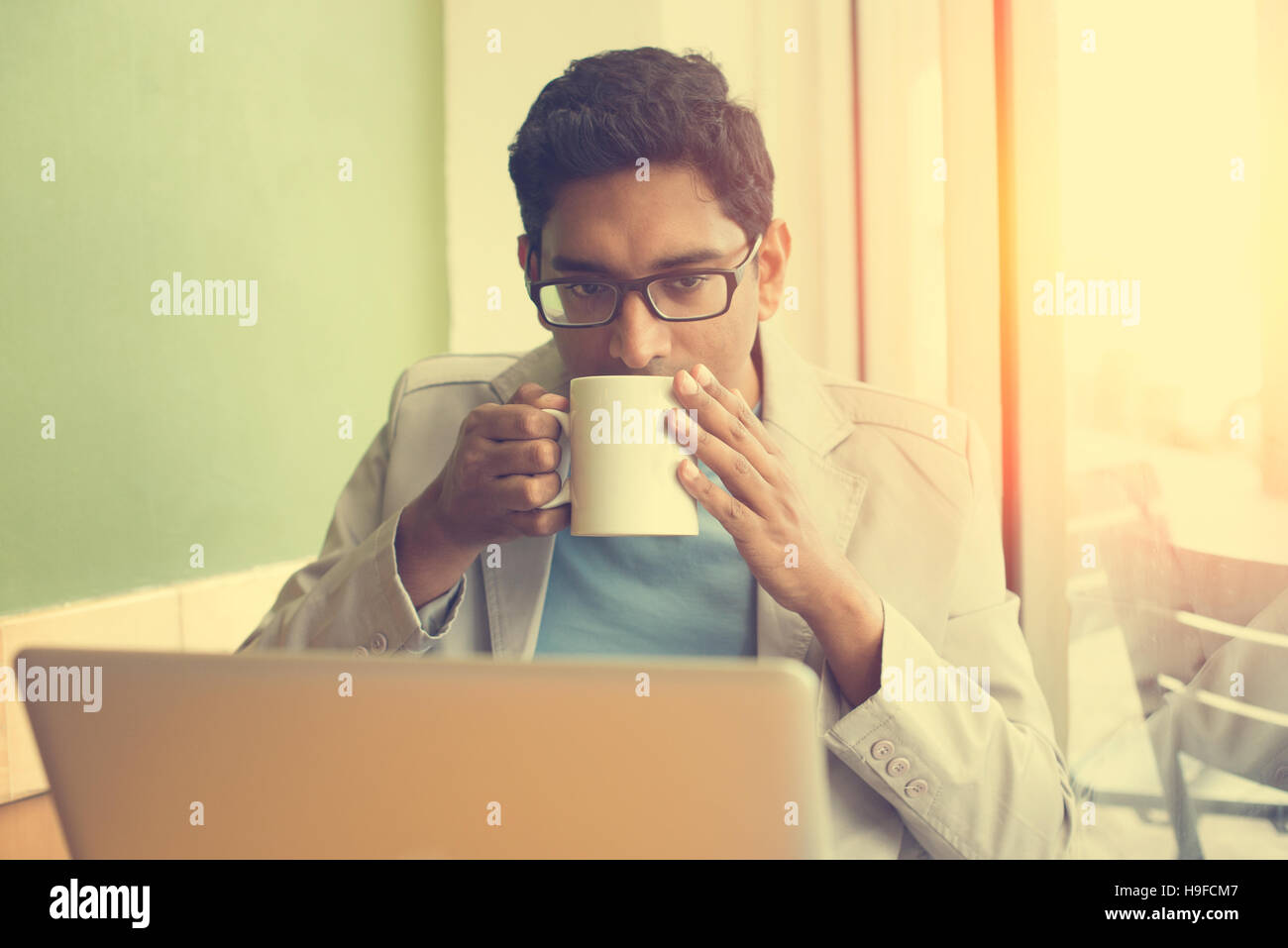indian male drinking coffee Stock Photo - Alamy