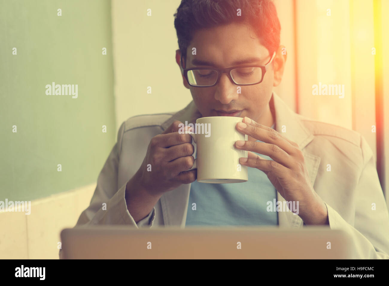 indian male drinking coffee Stock Photo - Alamy