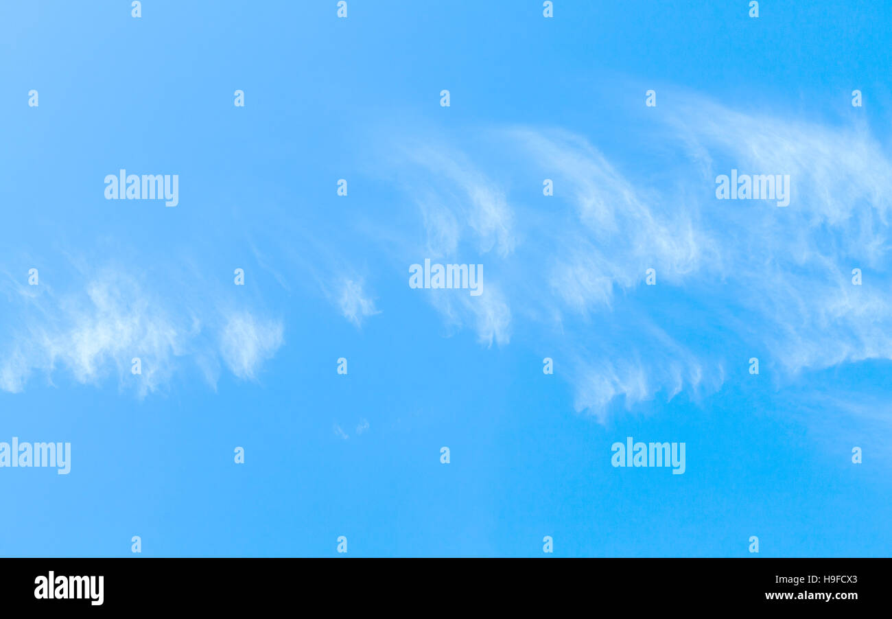 Mostly clear sky with small nice white cloud Stock Photo - Alamy