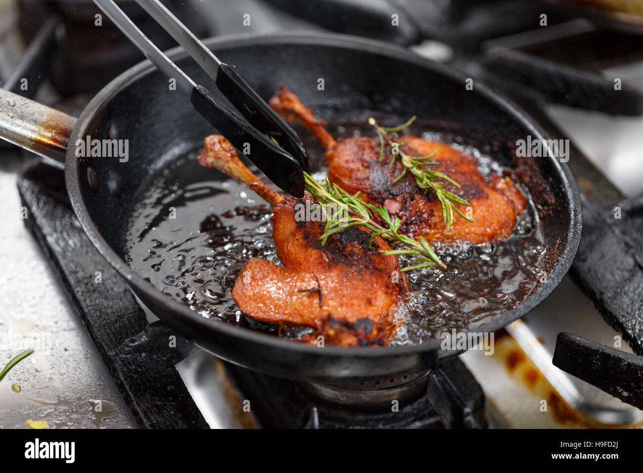 Duck legs frying Stock Photo - Alamy