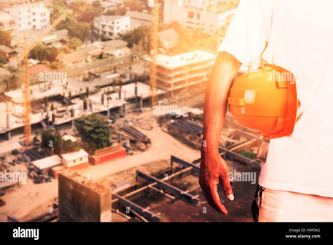 Workers man with safety helmet holding at the construction site Stock ...