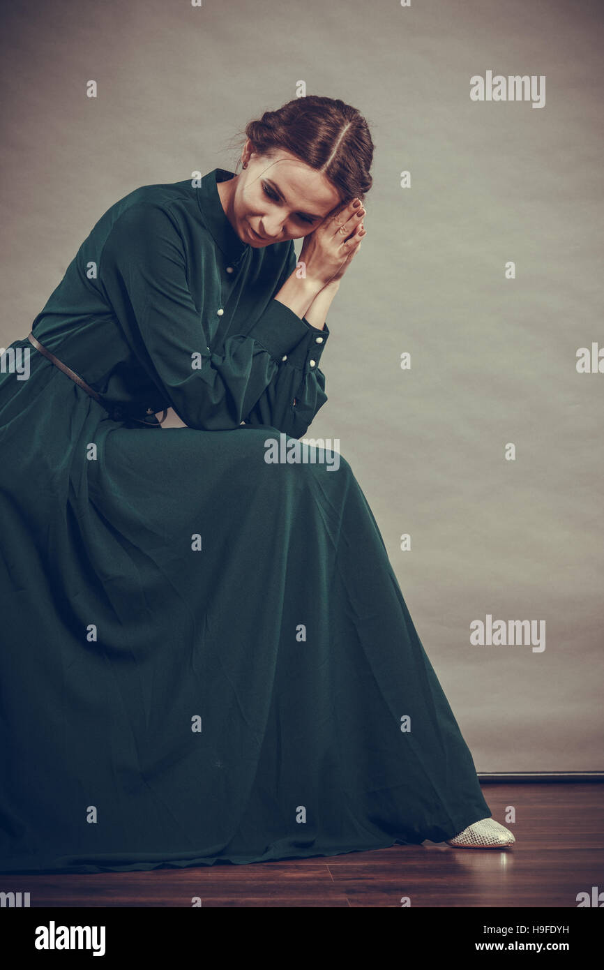Sad woman retro style portrait long dark gown, vintage photo Stock ...
