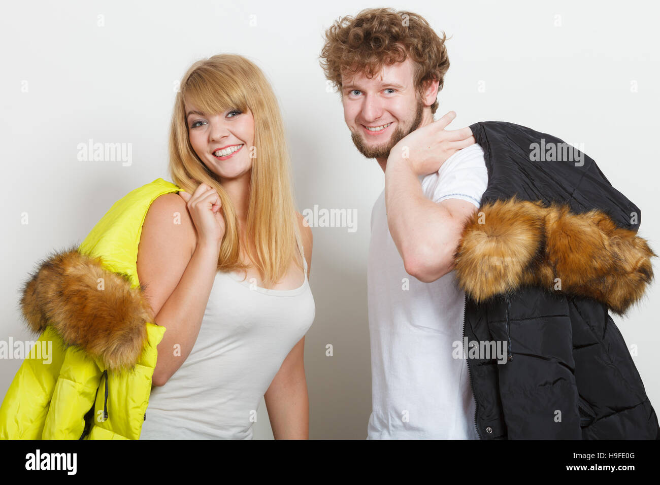 Happy joyful couple with fashionable jackets. Young man and woman in ...