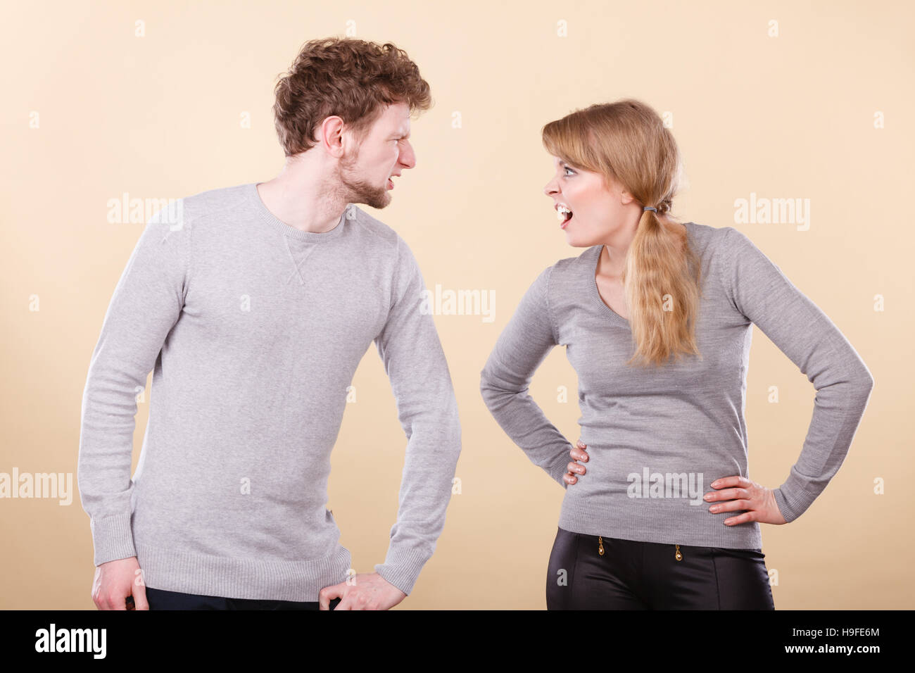 Problems in relationship. Young blonde couple arguing and yelling on ...
