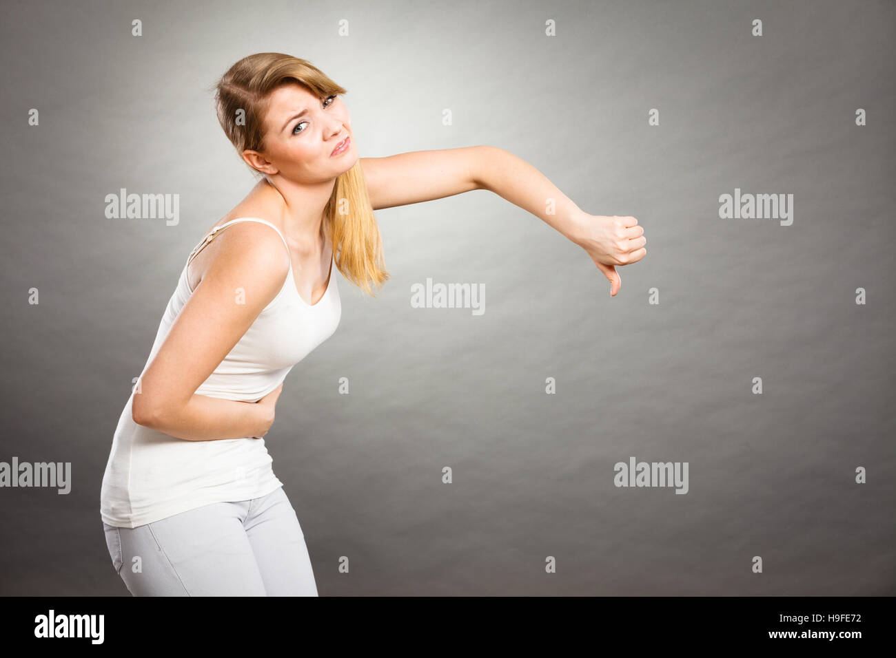 Woman hand stomach thumb hi-res stock photography and images - Alamy