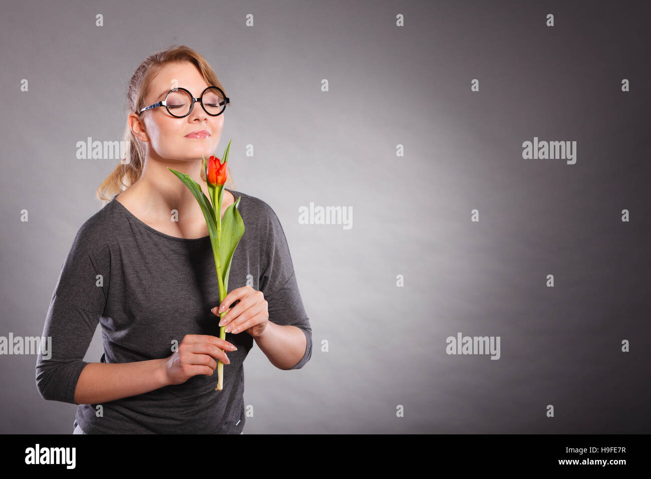 Peace and content. Beauty adorable girl smelling beautiful spring ...