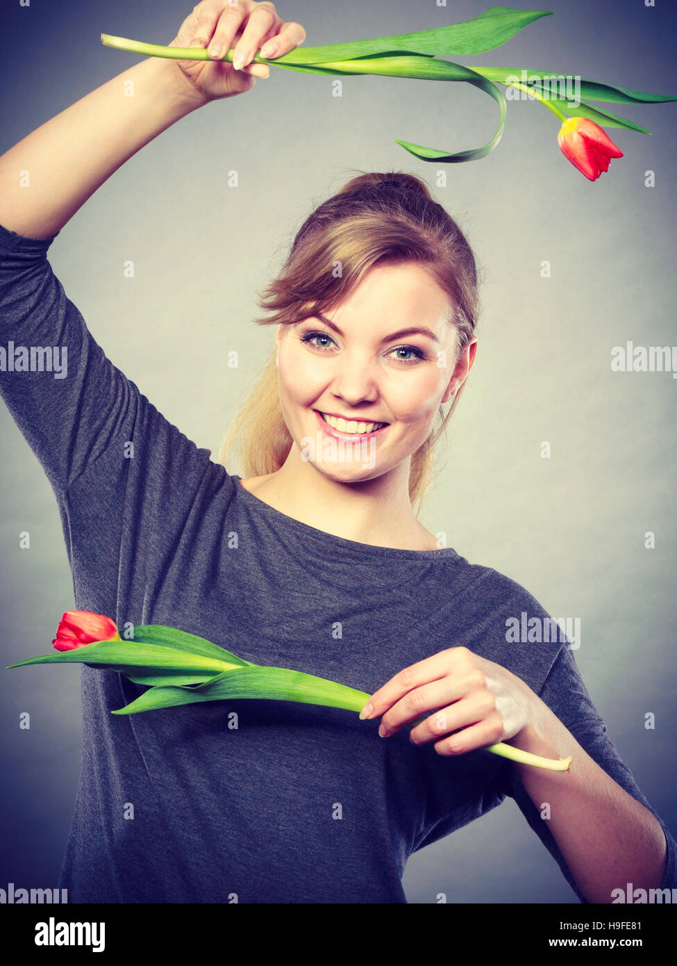 Spring time. Craziness and fun concept. Playful happy girl playing with ...