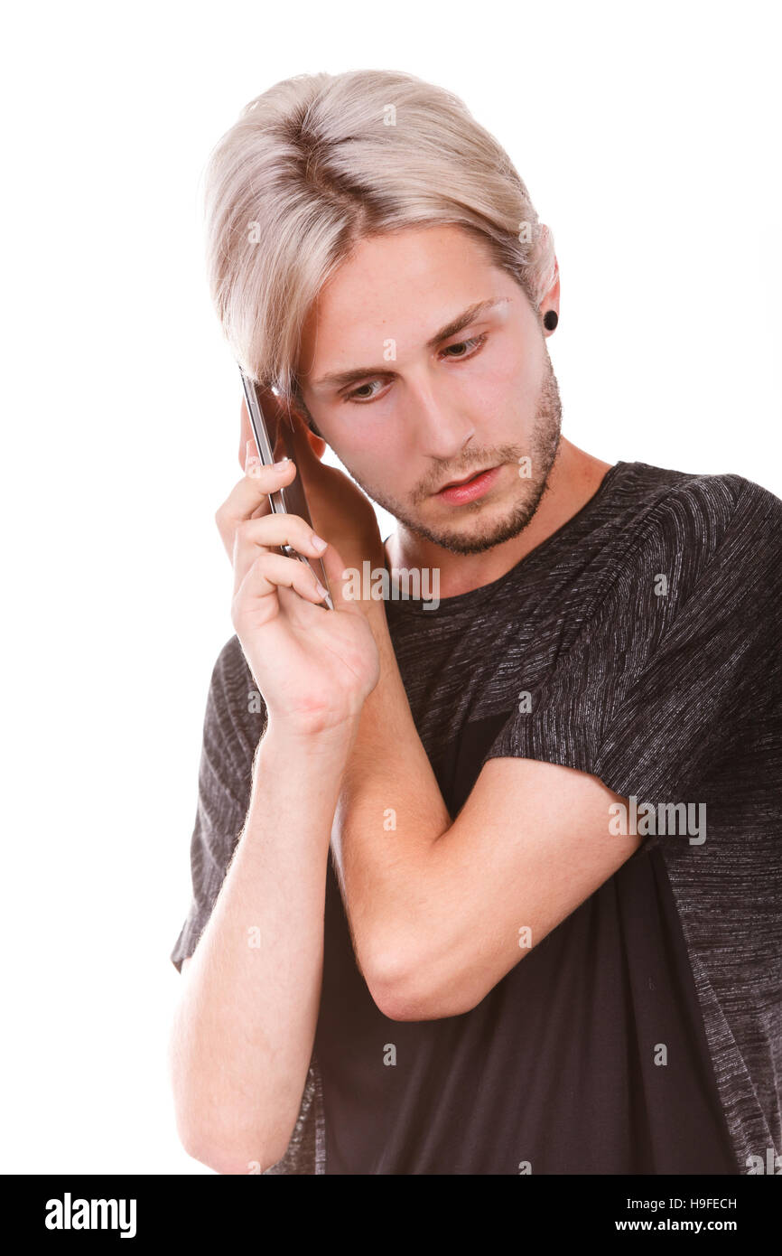 Technology and communication. Young man sad serious face expression ...