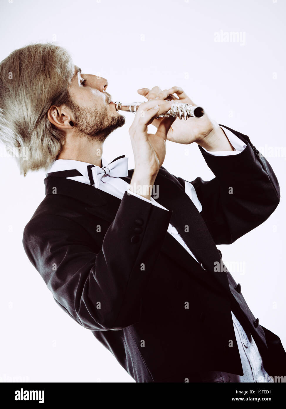 Flute playing male model hi-res stock photography and images - Alamy