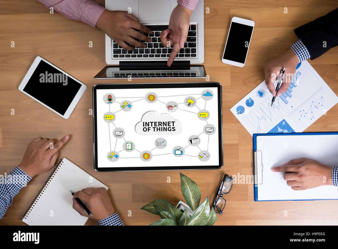 IOT business man hand working and internet of things (IoT) word Stock ...