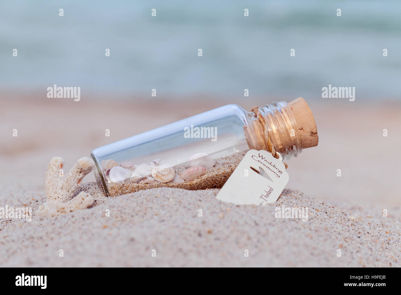 Sand and sea shell in bottle put on the beach concept for weddi Stock ...