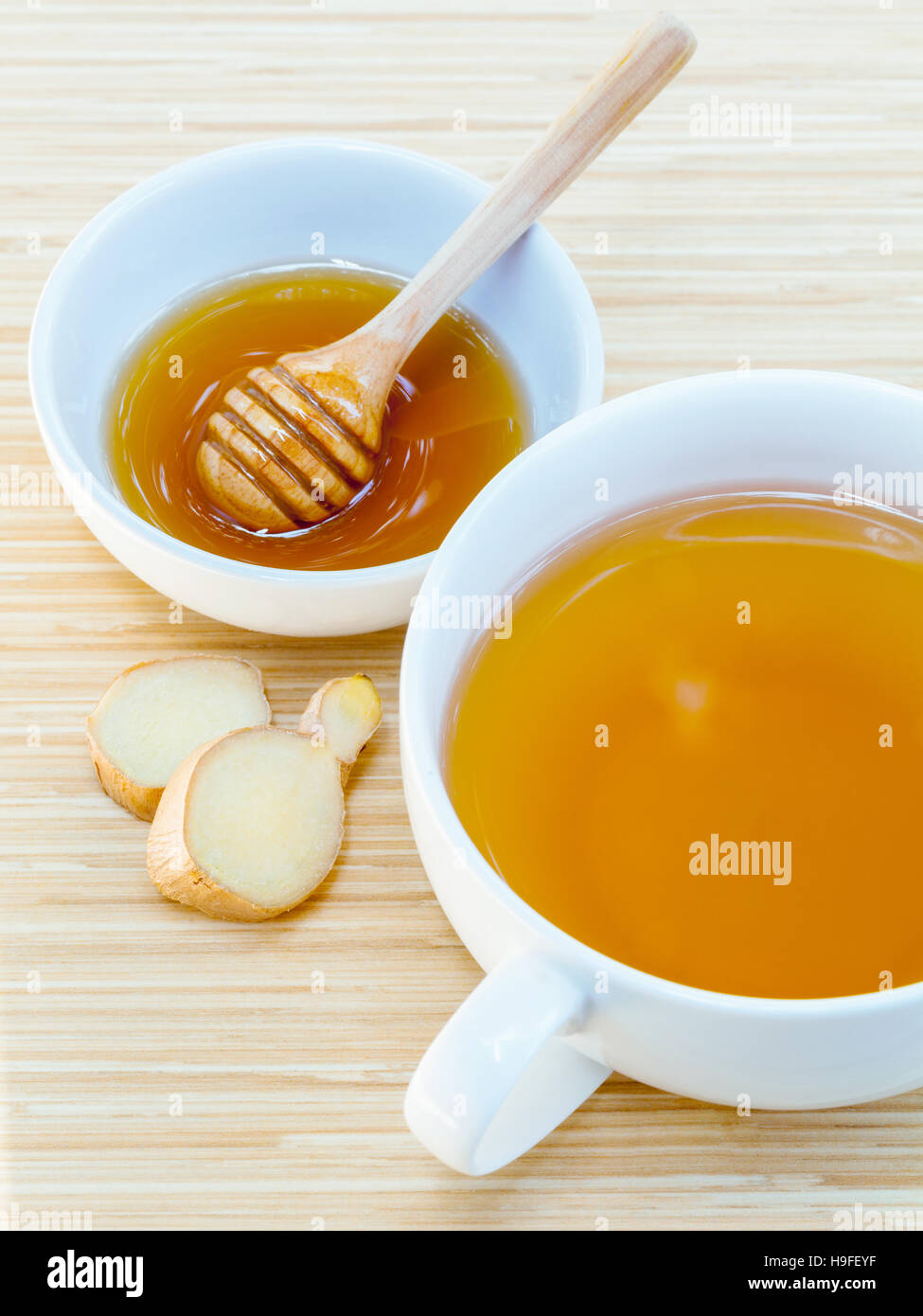 A Cup of ginger tea with honey on wooden background, concept for Stock ...