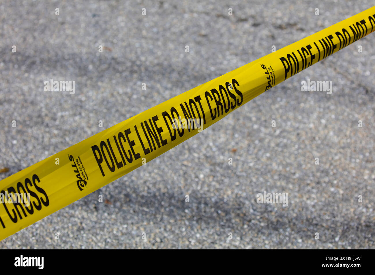 Police line do not cross yellow tape Stock Photo - Alamy