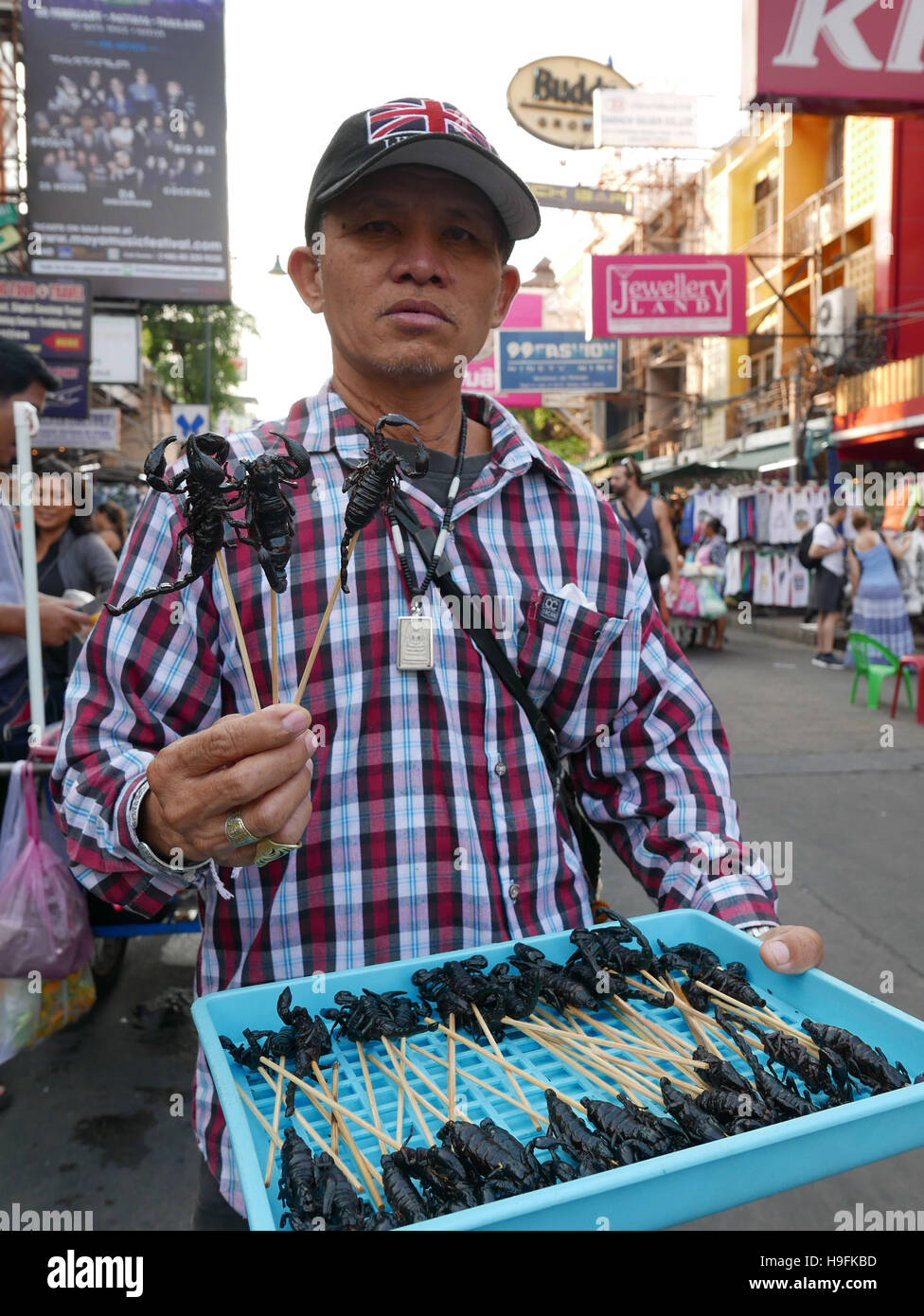 THAILAND Bangkok. Khao San Road. Man selling scorpions to eat. Sean ...