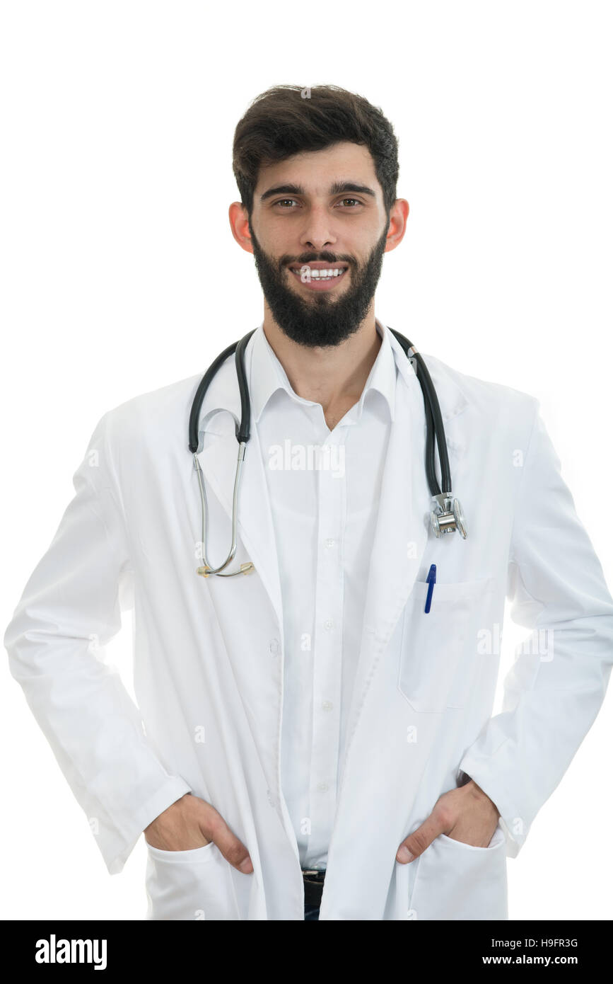 Young serious handsome bearded doctor with white coat and stethoscope ...