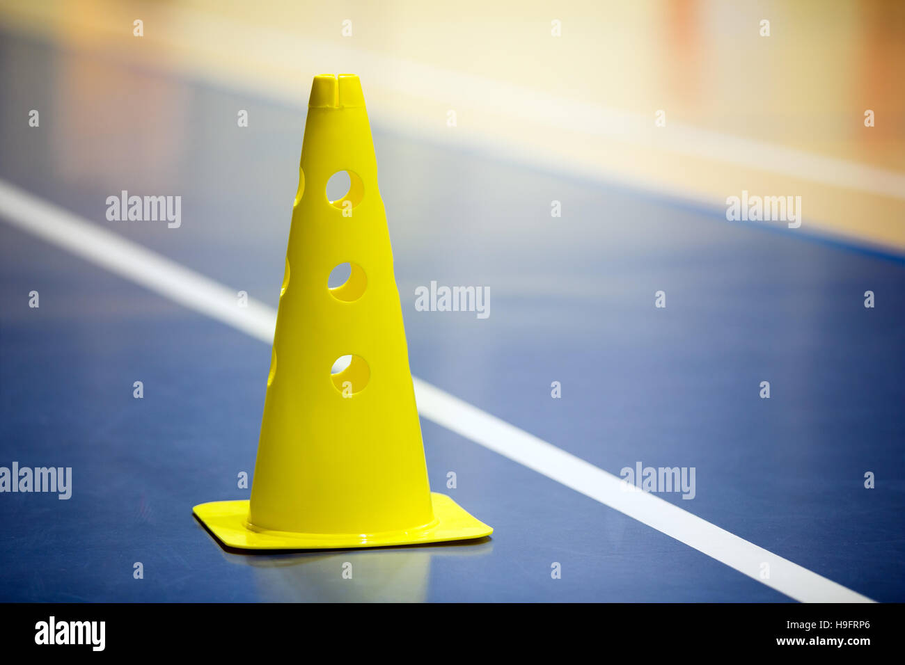 Training soccer futsal indoor gym training. Soccer cone on wooden ...