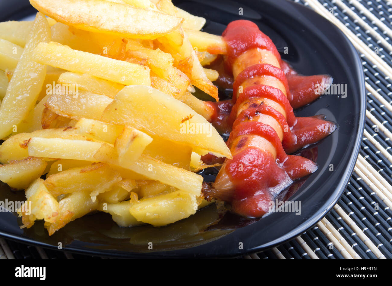 Russian national dish - fried sausage with tomato ketchup and a side ...