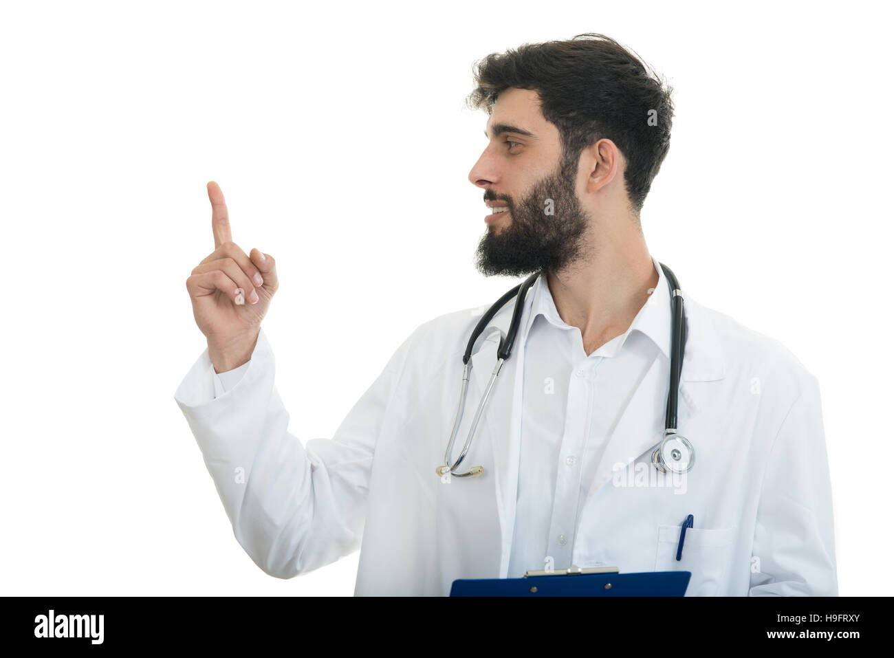 Male doctor makes a pointing finger gesture, isolated over a white ...