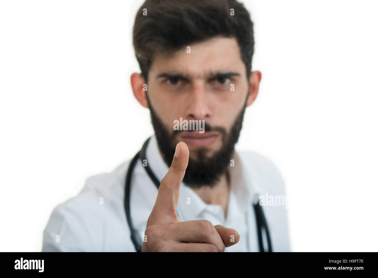A close-up portrait of a rude, frustrated, upset doctor isolated on a ...
