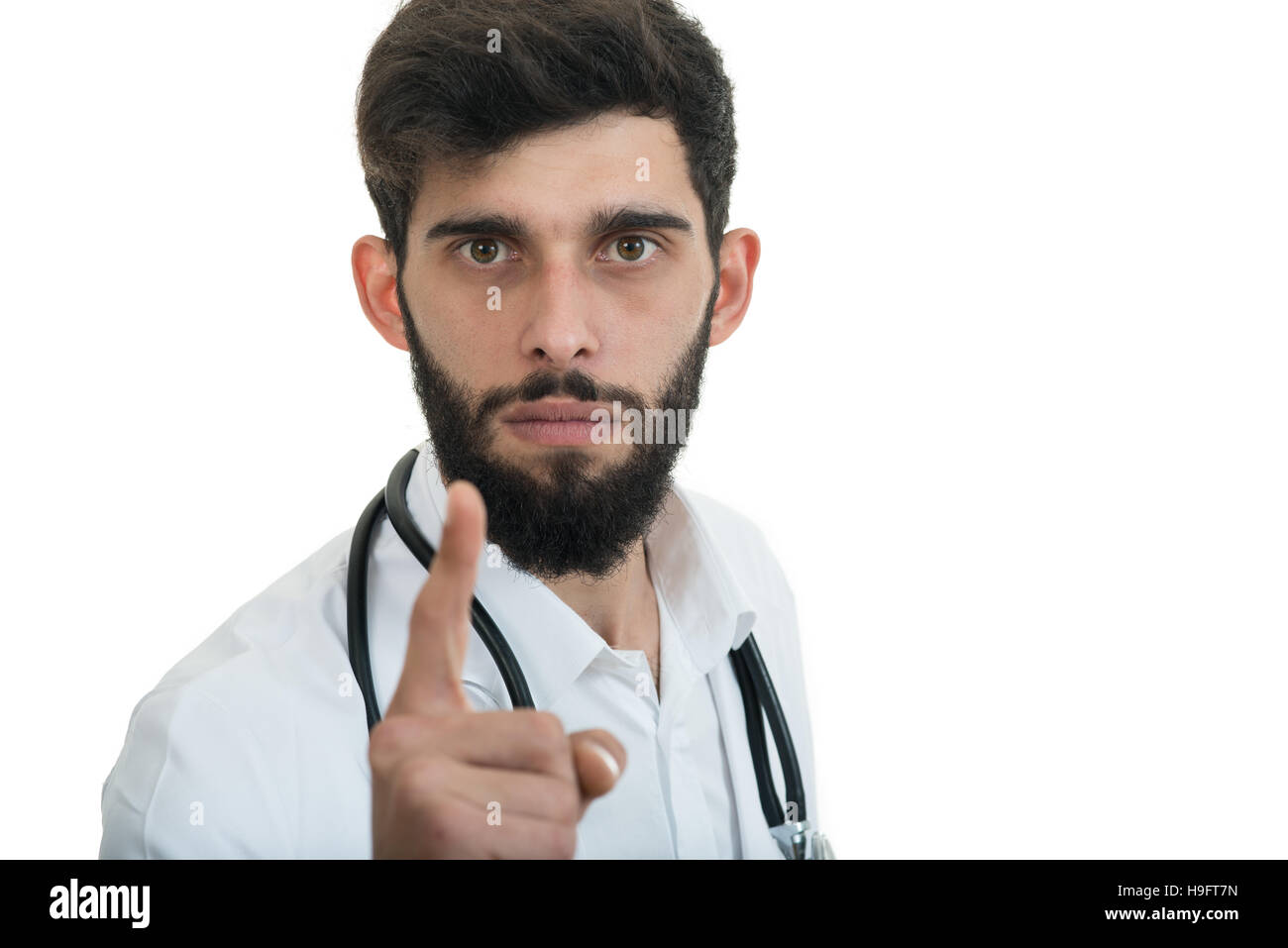 A close-up portrait of a rude, frustrated, upset doctor isolated on a ...
